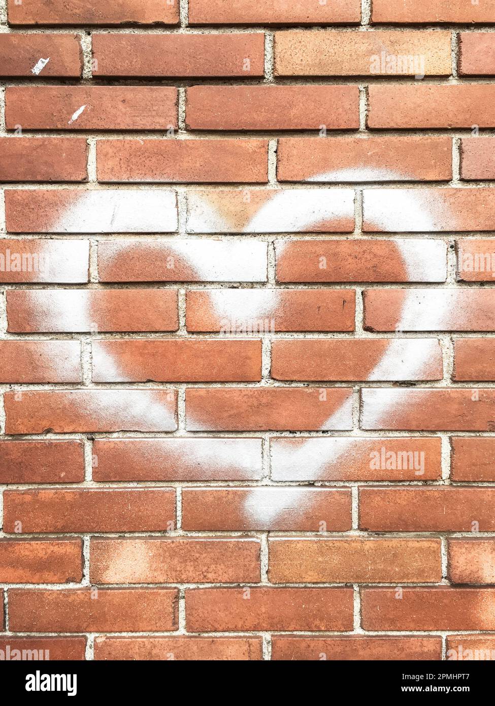 Concept or conceptual painted white abstract love symbol in heart shape ...