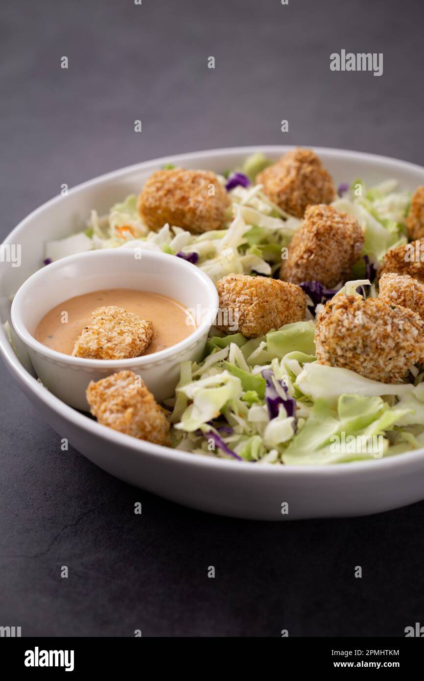 A white ceramic bowl filled to the brim with delicious meatballs ...