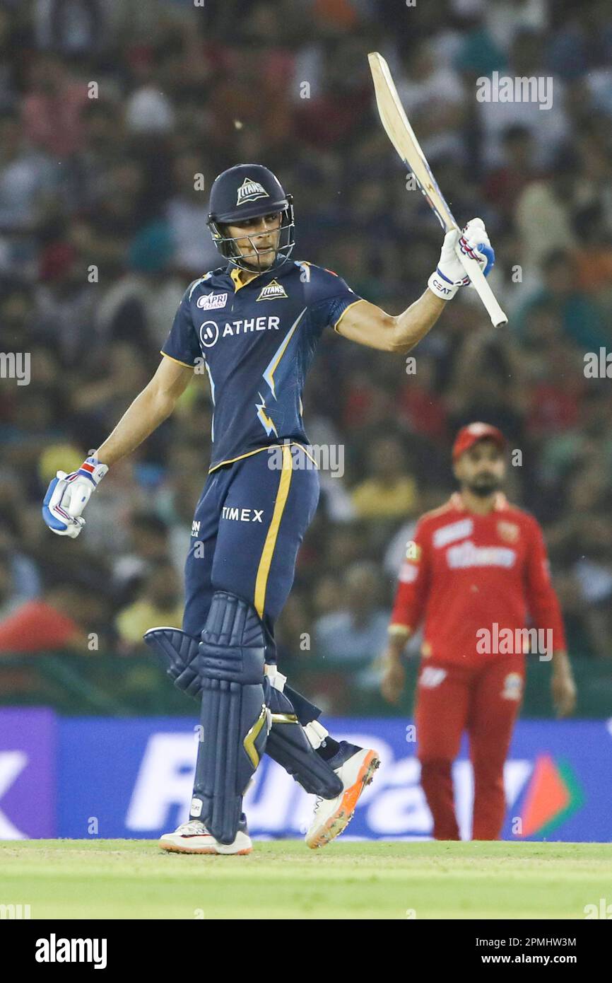 Shubman Gill of Gujarat Titans raises his bat after scoring fifty runs ...