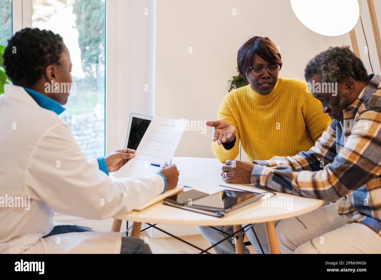 Doctor giving the test results and bad news to the patient in ...