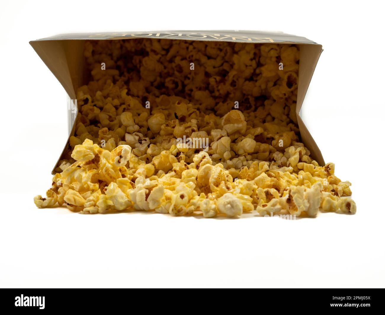 Popcorn in a cardboard box on a white background. Sweet popcorn on ...