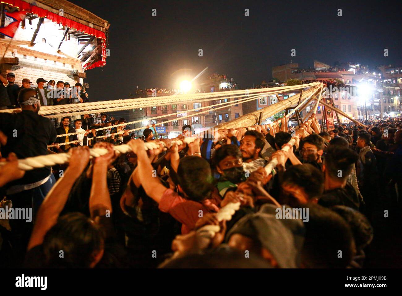 Nepal. 13th Apr, 2023. Hindu devotees pull a long ceremonial pole ...