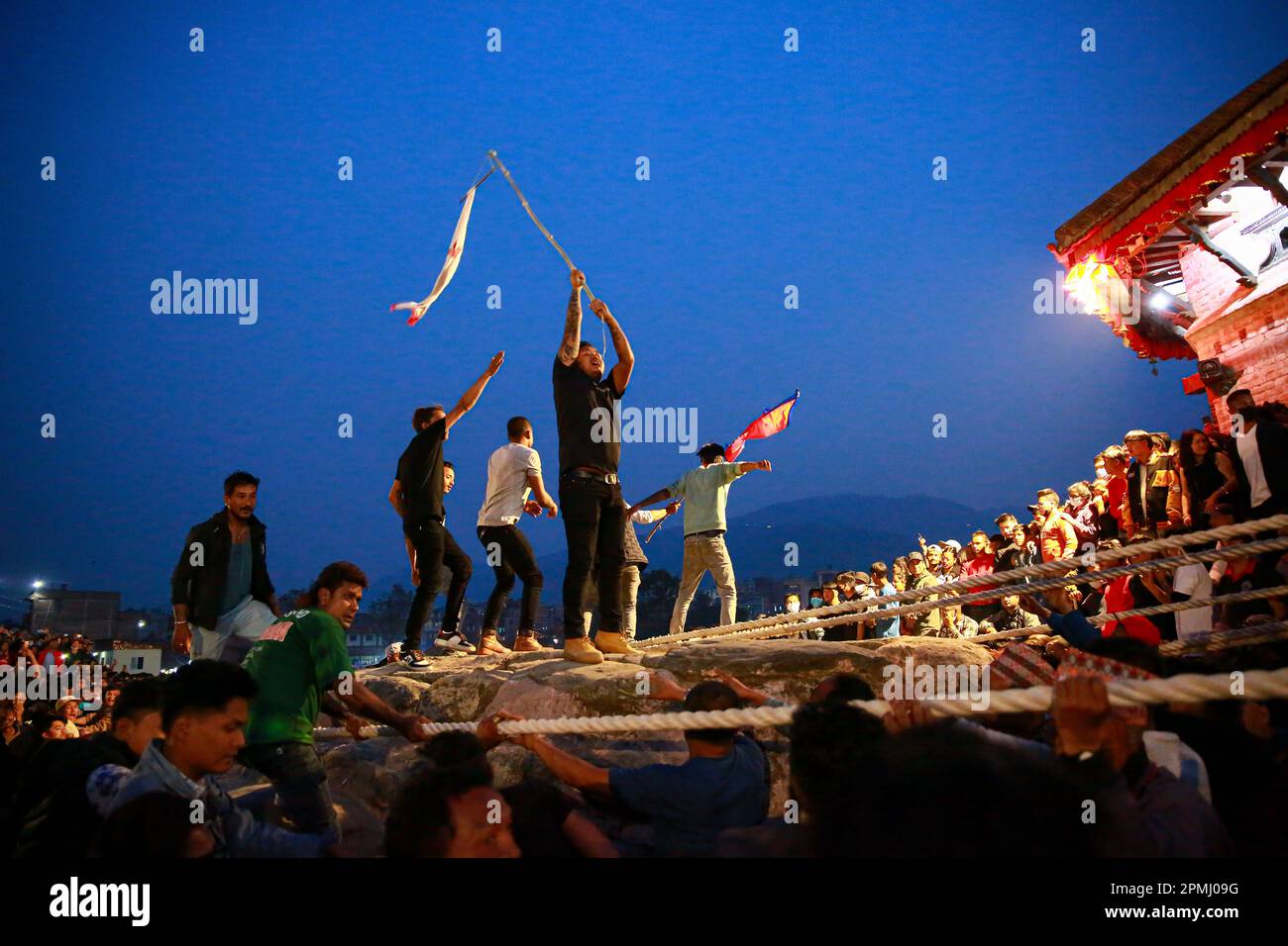 Nepal. 13th Apr, 2023. Hindu devotees pull a long ceremonial pole ...