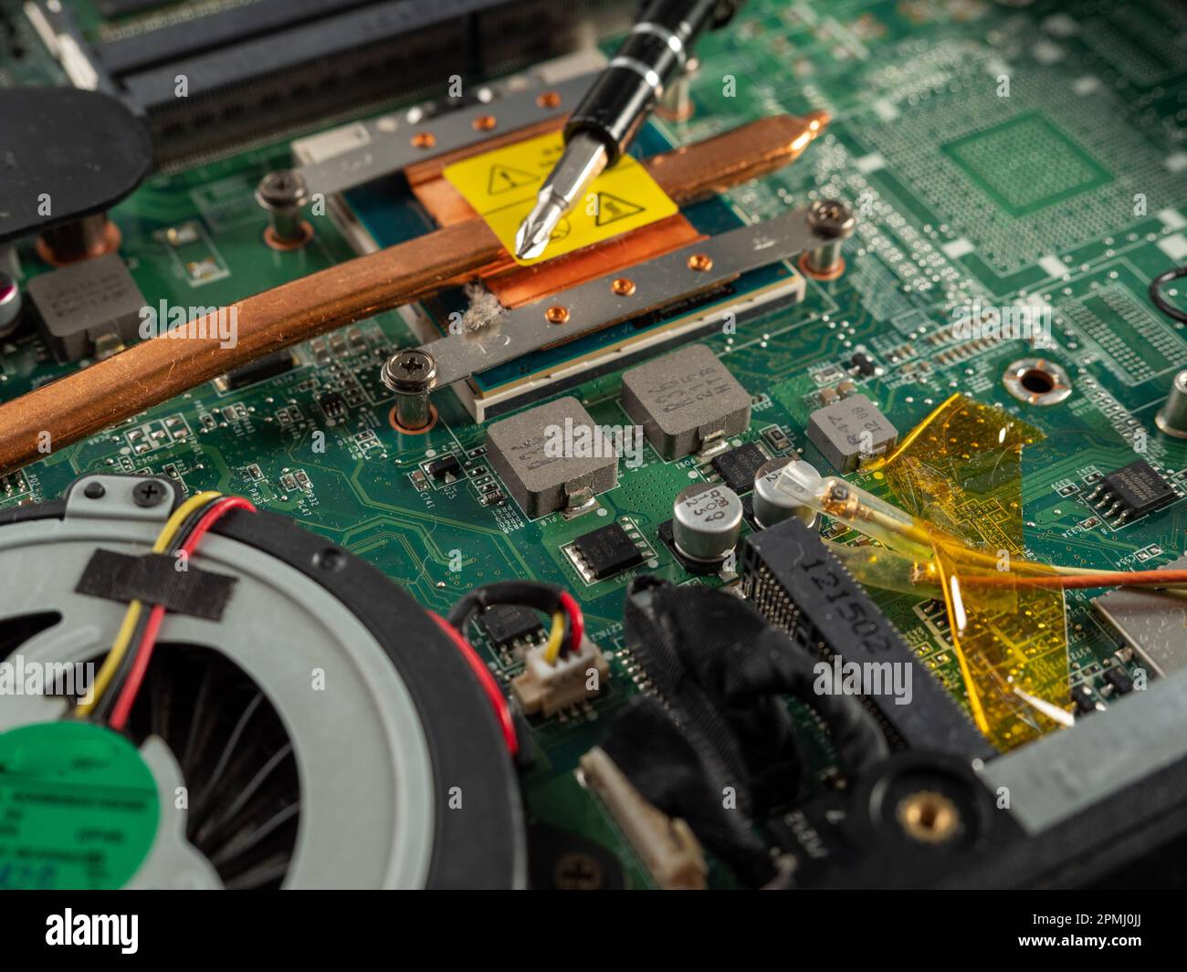 Electronic board of an old broken laptop. Dusty broken laptop under ...