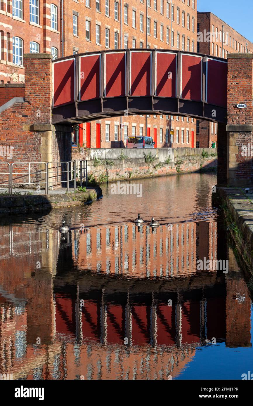 Reflection of Footbridge and warehouses in Murray Mills Redhill Street ...