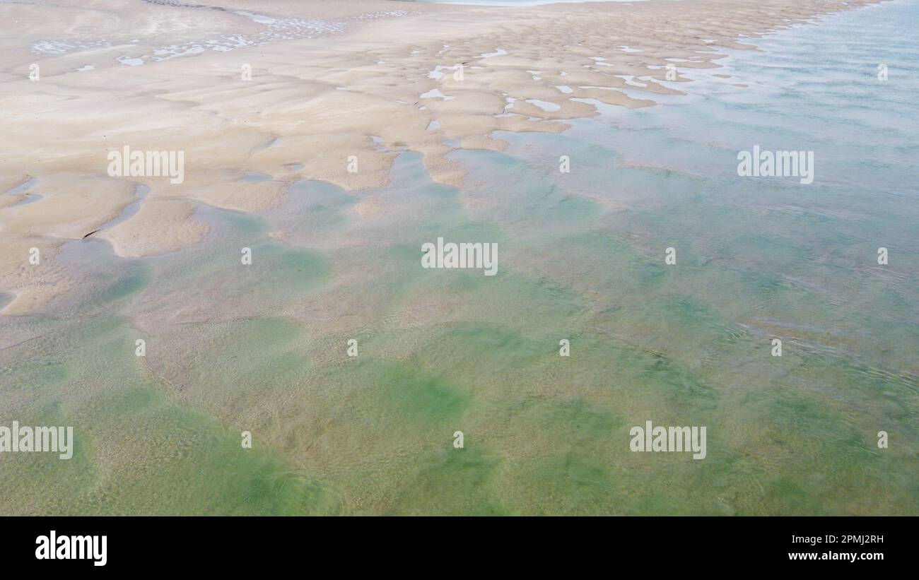 Wet beach sand at low tide, top view. Unusual sandy texture Stock Photo ...