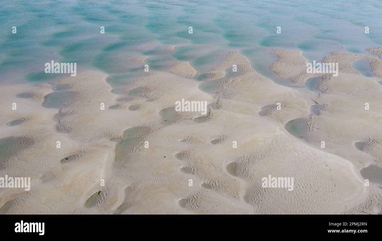beach sand at low tide, top view. Unusual sandy texture Stock Photo - Alamy