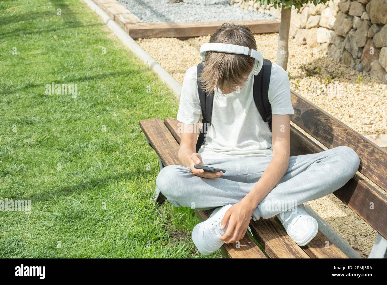 Adolescent scrolling smart phone hi-res stock photography and images ...