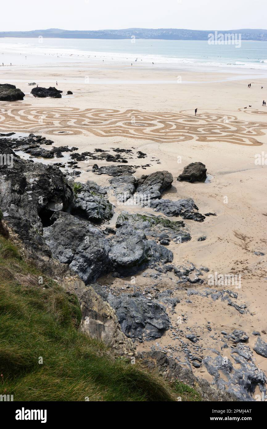 Beach sand artist and his work near Godrevy Point, North Coast of ...
