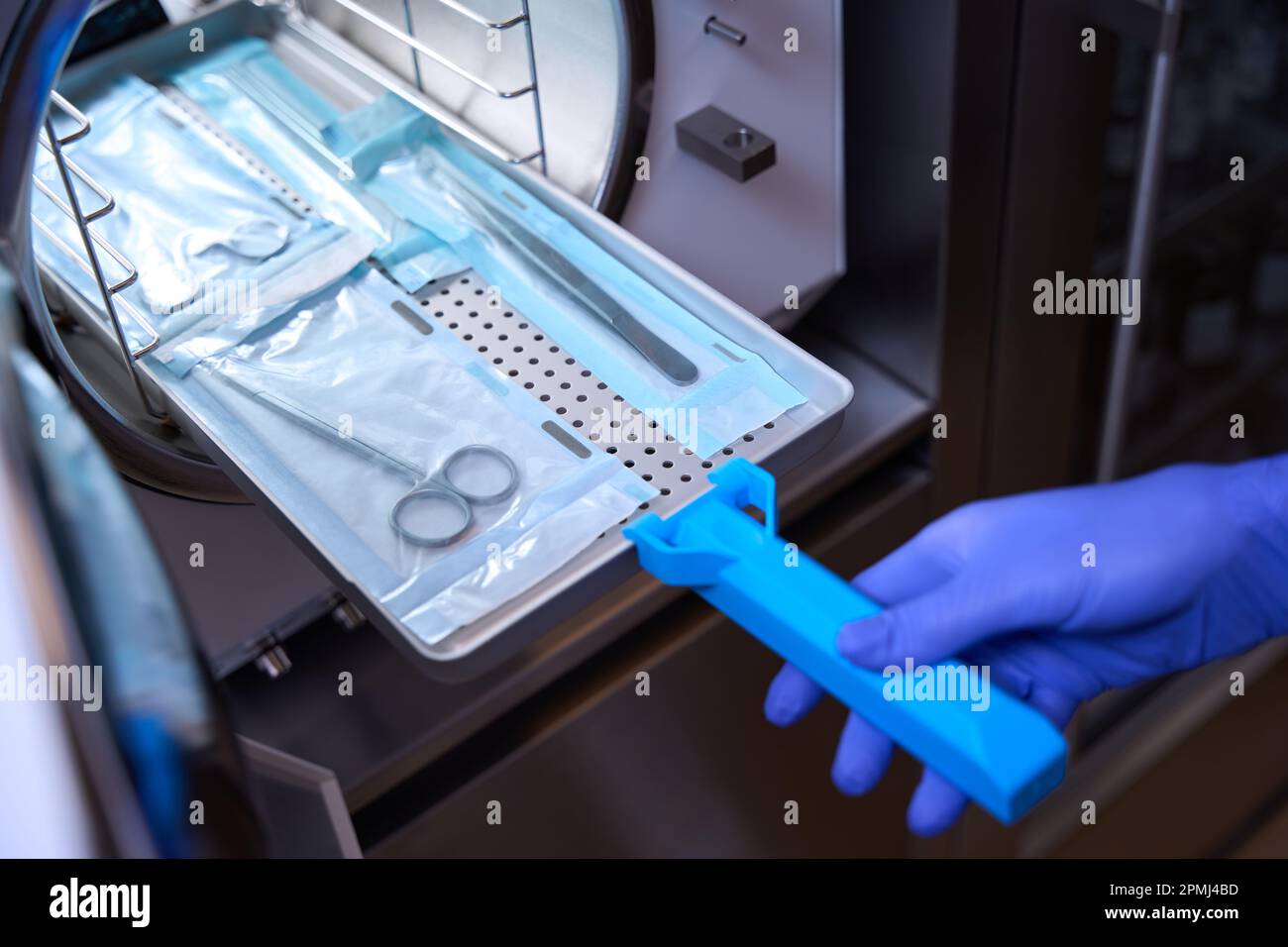 Cropped photo the process of sterilizing medical instruments in an ...