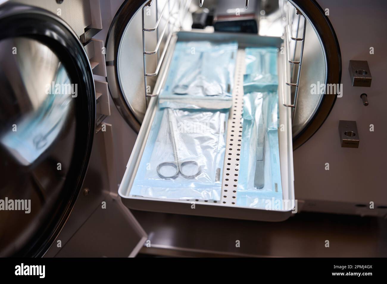 Close up of sterilizing medical instruments in an autoclave in clinic ...