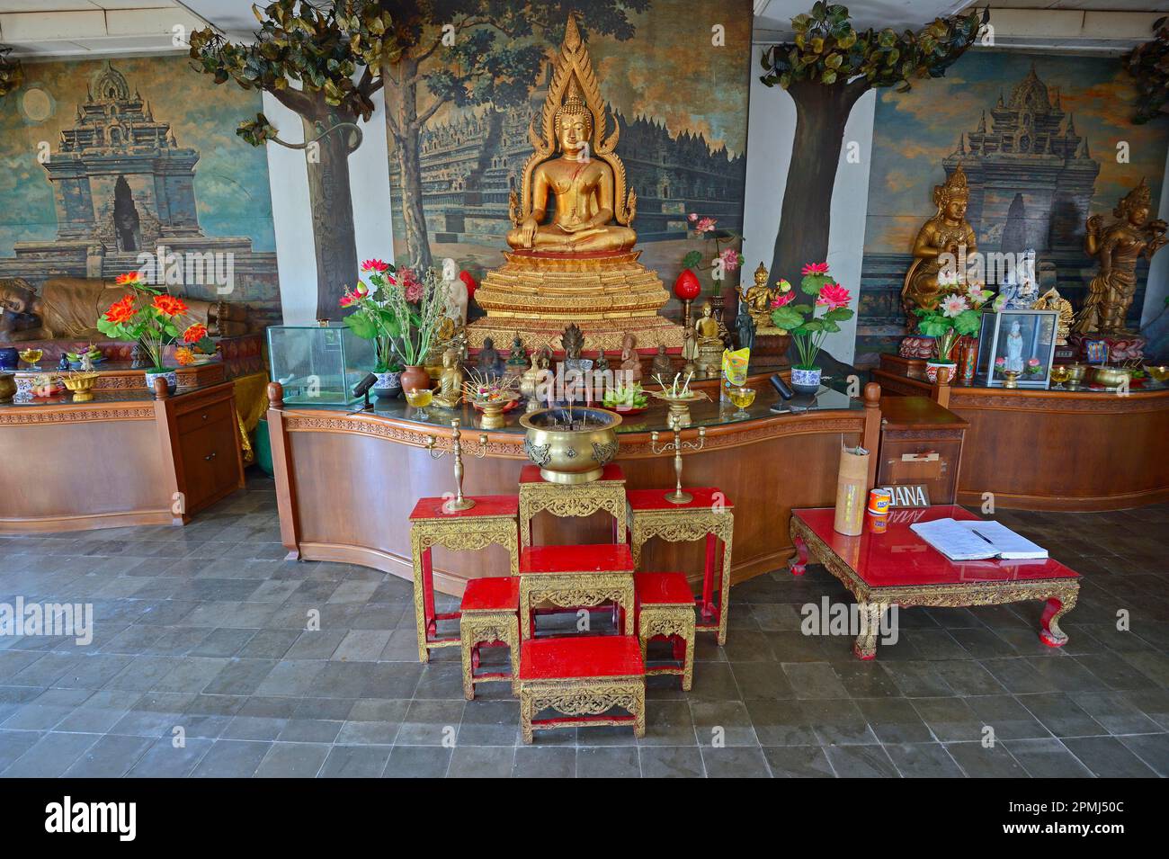 Buddha statue on an altar in a prayer room of the Buddhist monastery ...