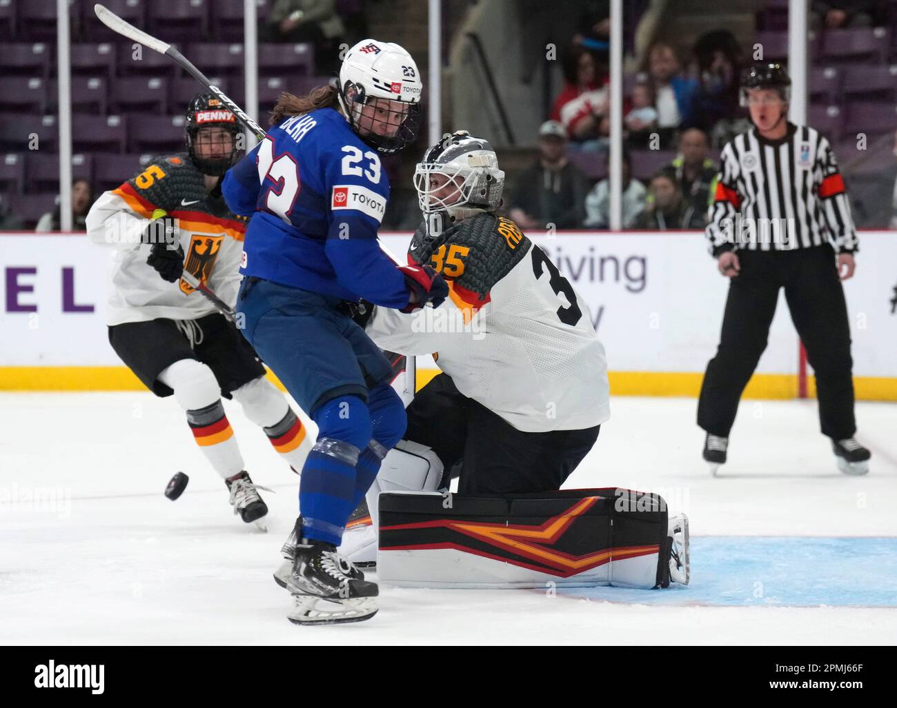 Germany goaltender Sandra Abstreiter (35) makes a save as USA forward ...