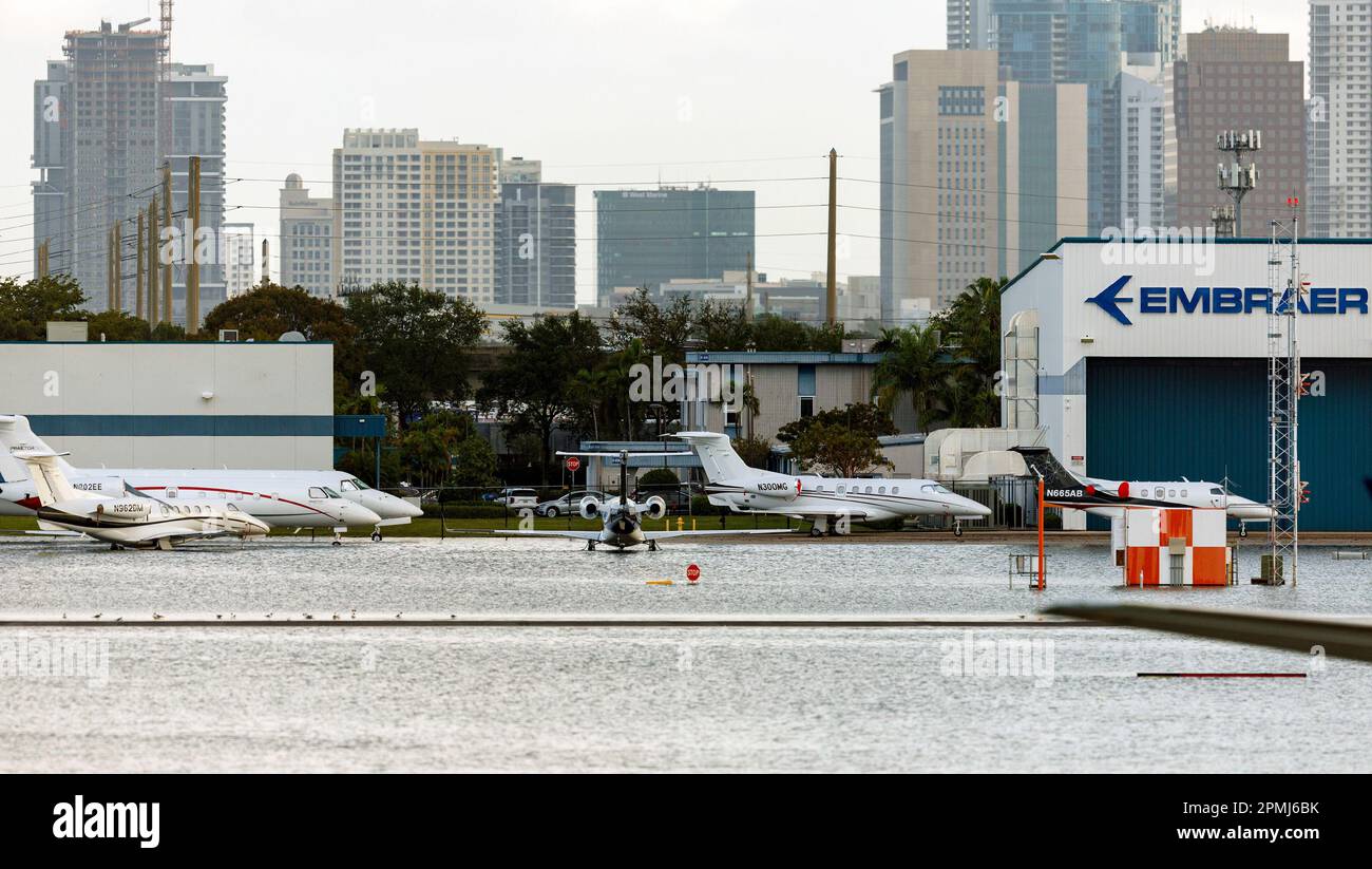 Private jets next to their hangar as the runway remains flooded from ...