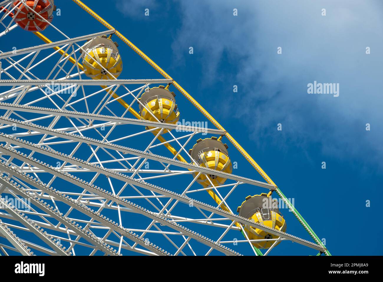 Multicolour ferris wheel isolated on blue sky background, Having fun on ...