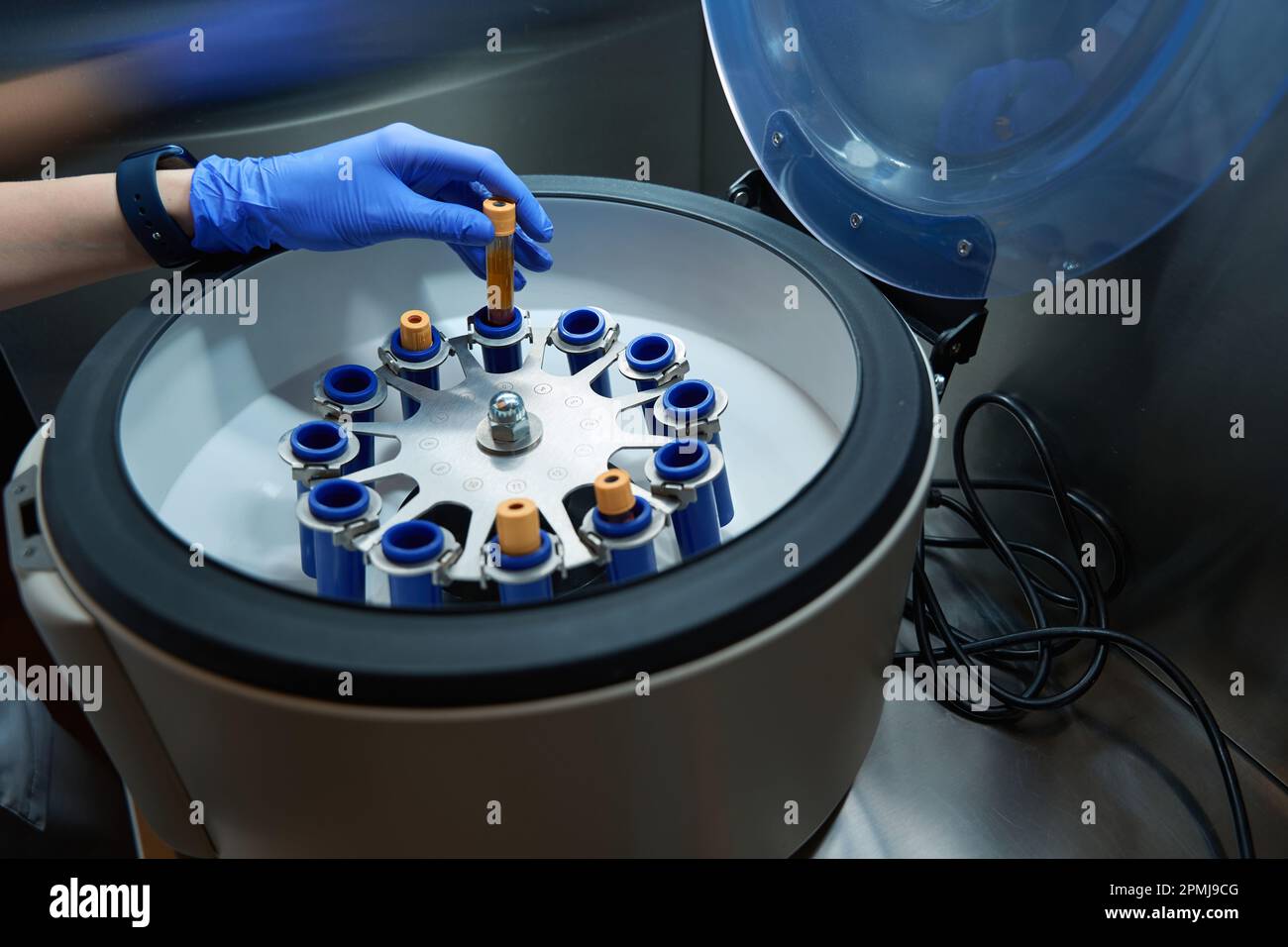 Cropped photo production of plasma from blood in a separator Stock ...