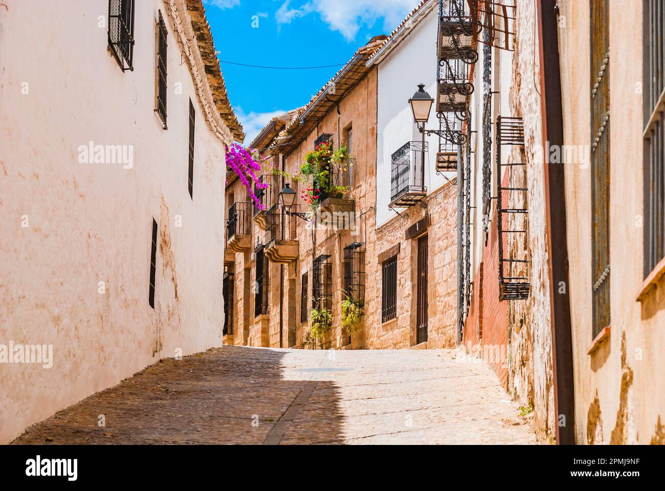 Ancient street in the medieval district. Baños de la Encina, Jaén ...