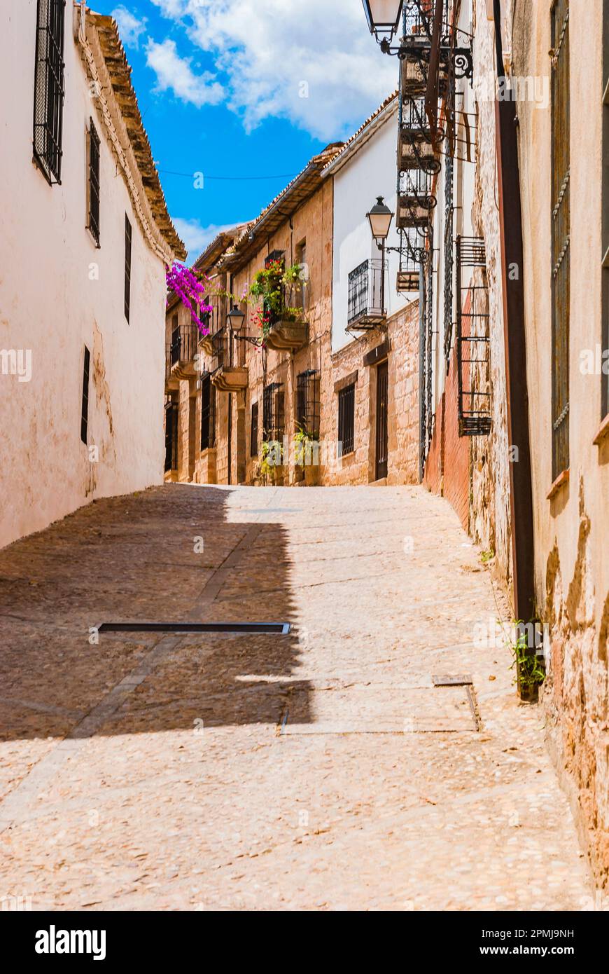 Ancient street in the medieval district. Baños de la Encina, Jaén ...