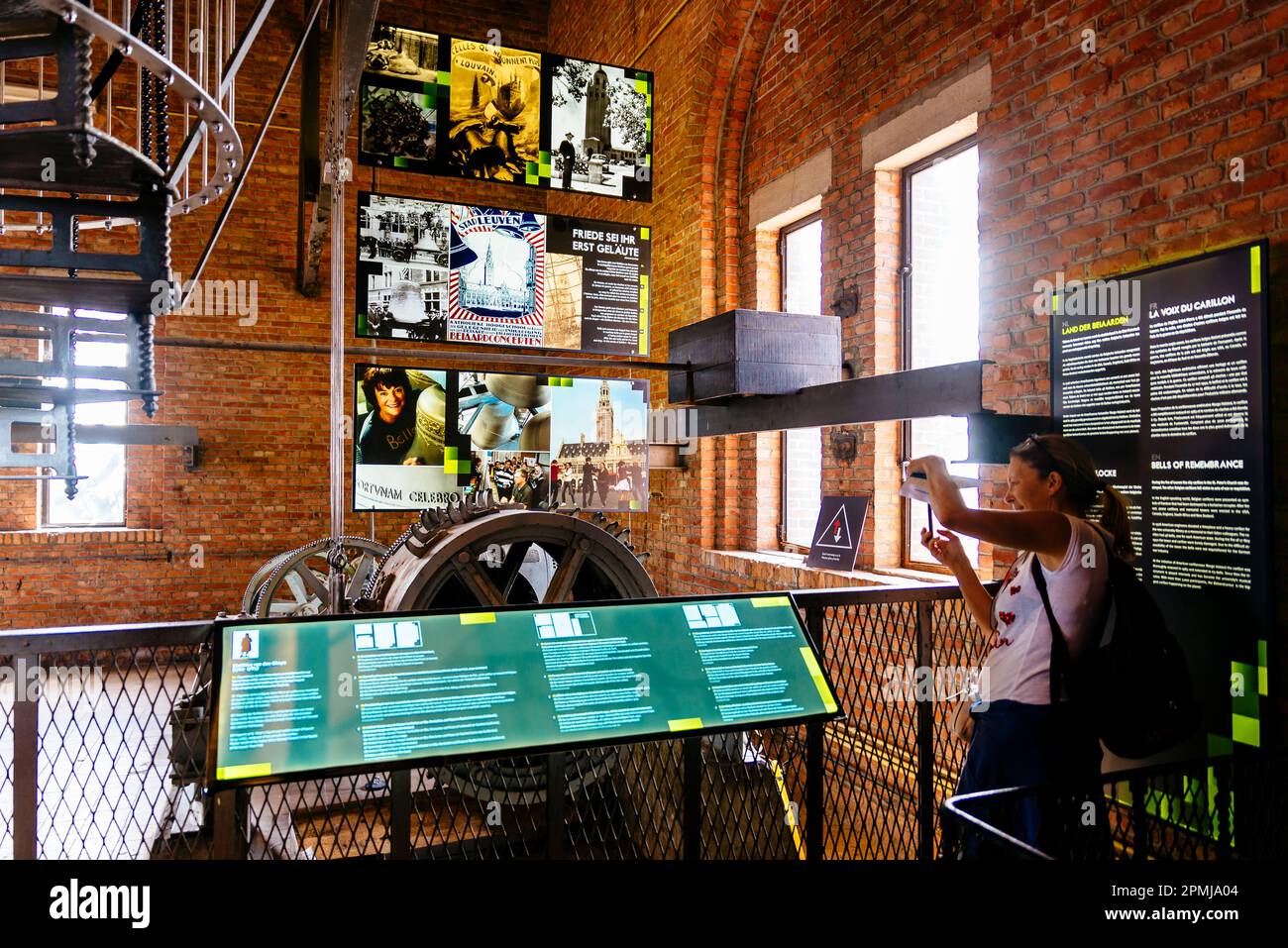 Tourist photographing the playing barrel for the quarter chimes. The ...