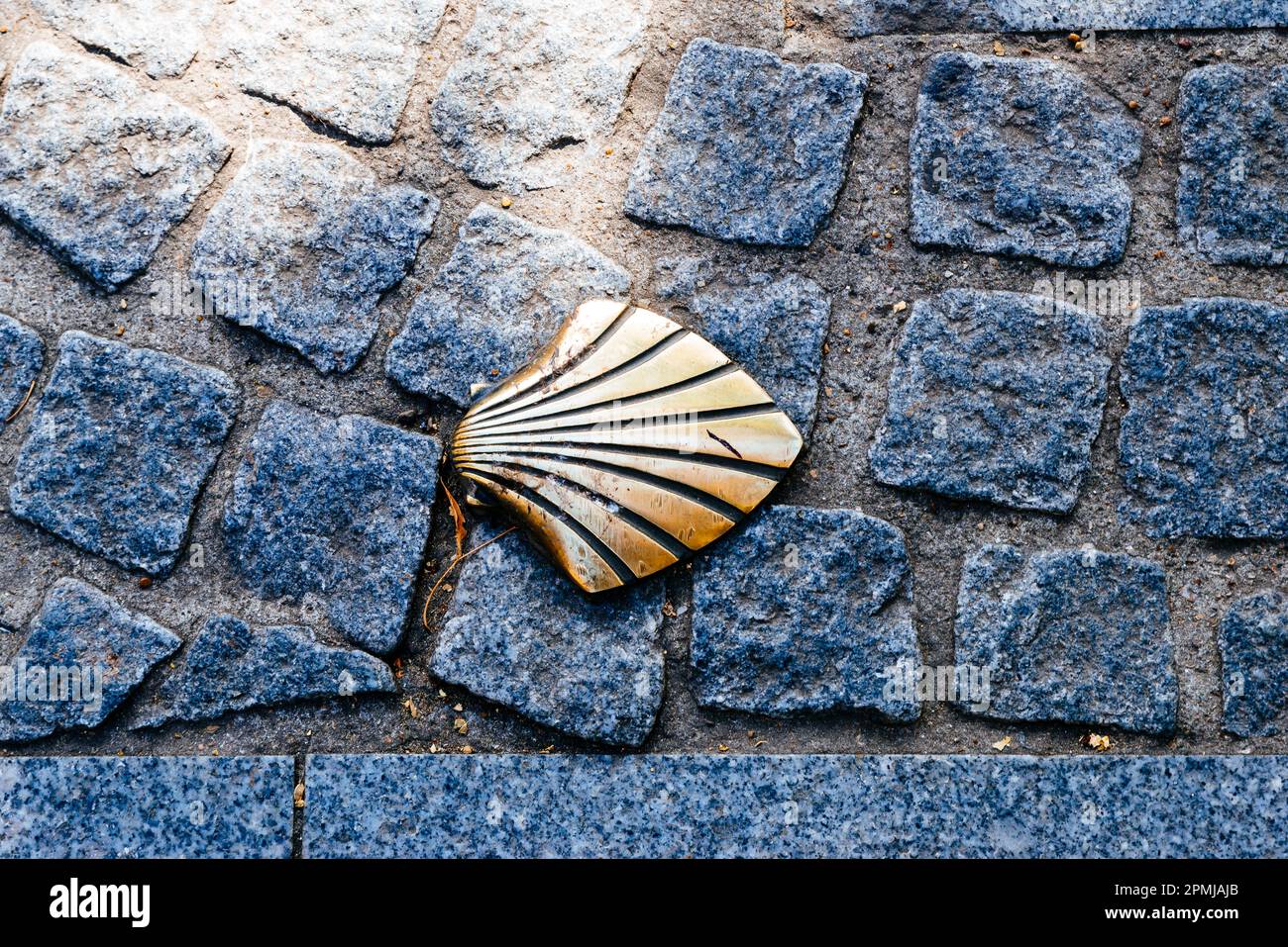 A scallop, symbol for the pilgrimage to Santiago de Compostela, near ...