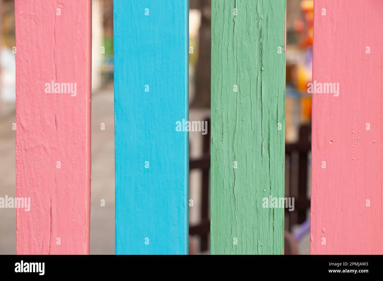 wooden multi-colored fence as background Stock Photo - Alamy
