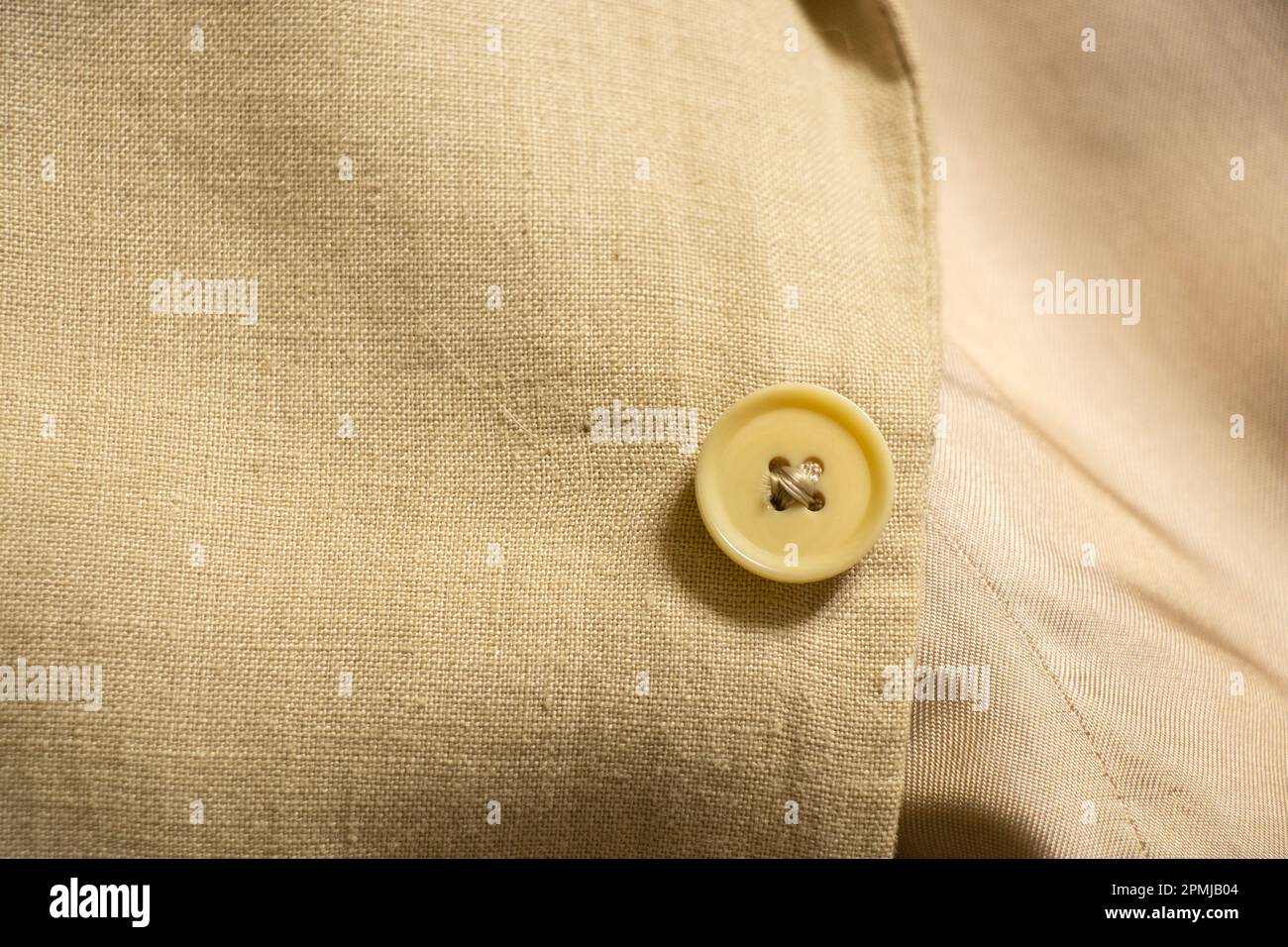 beige button on a jacket Stock Photo - Alamy
