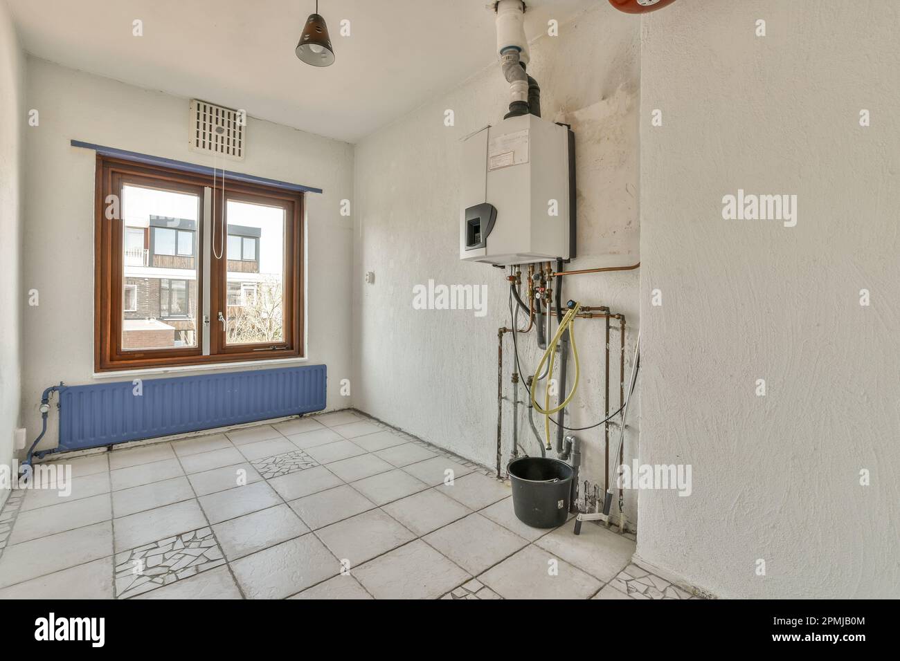 an air condition system in the corner of a room with tiled floor and ...