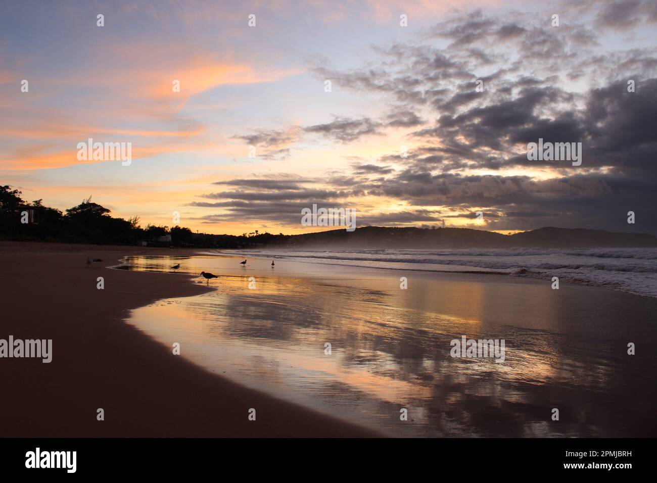 Sunrise reflections at Geriba beach, Buzios, Brazil Stock Photo - Alamy