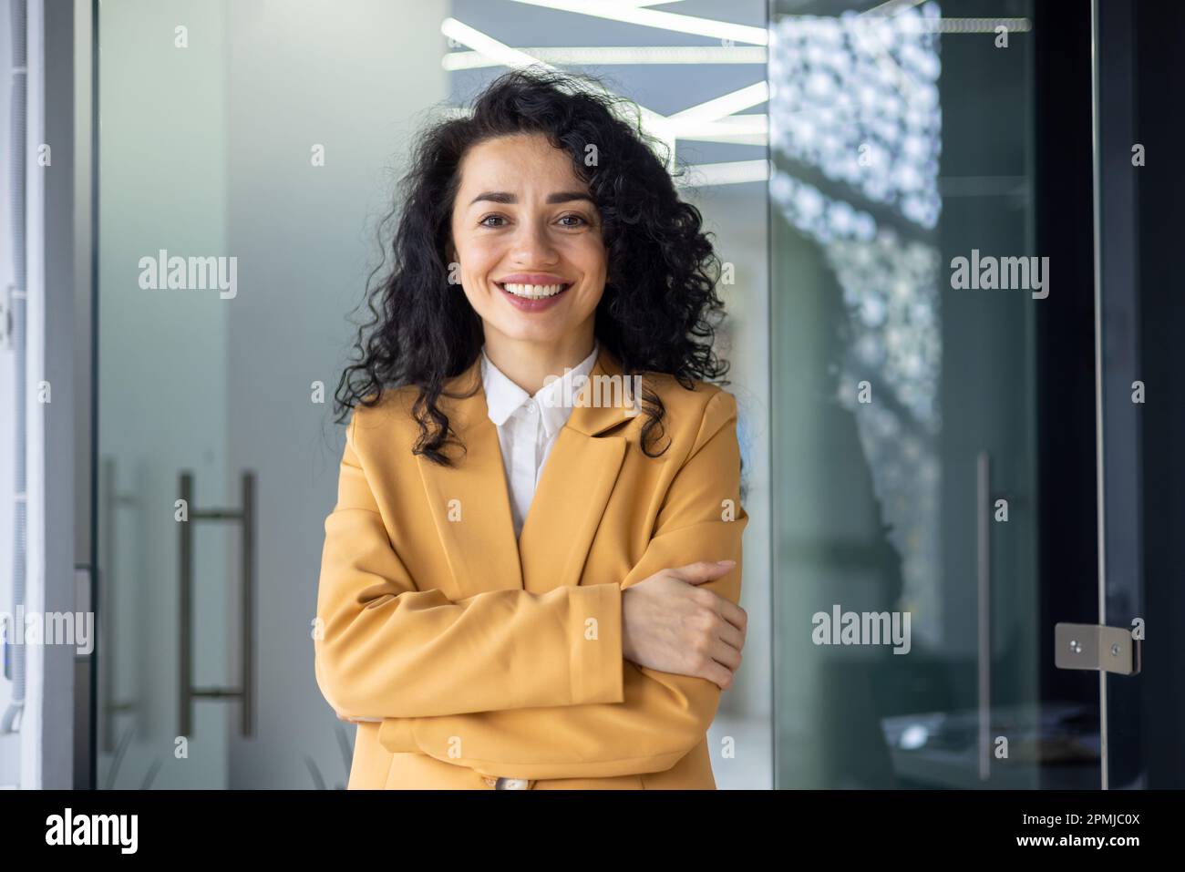 Portrait of successful business woman inside office, latin american ...