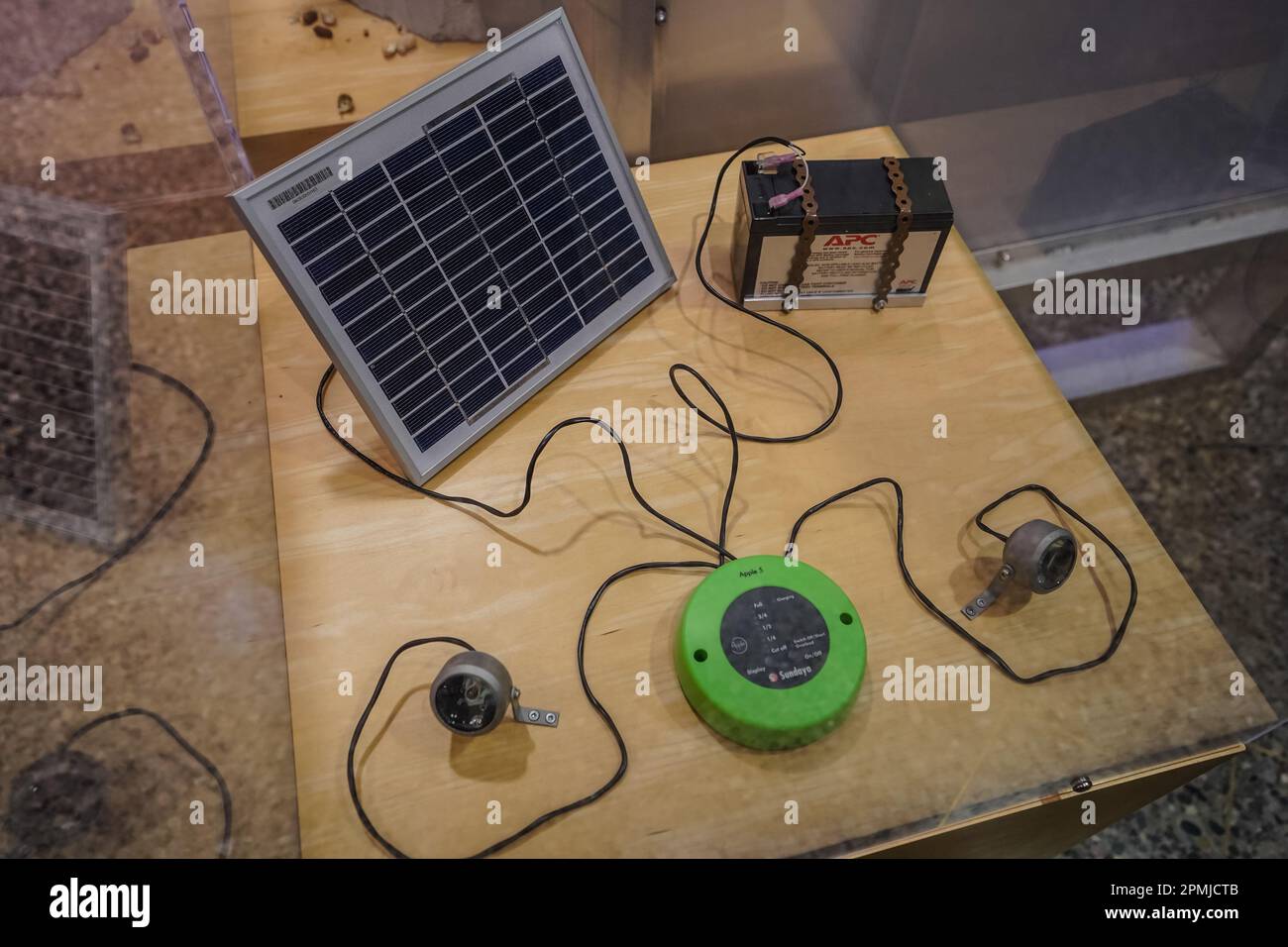 A small solar energy setup with a light and a battery Stock Photo - Alamy
