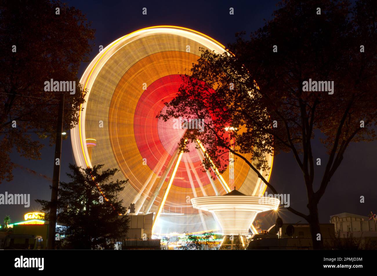 Ferris wheel at county fair at night, Karlsruhe, Germany Stock Photo ...