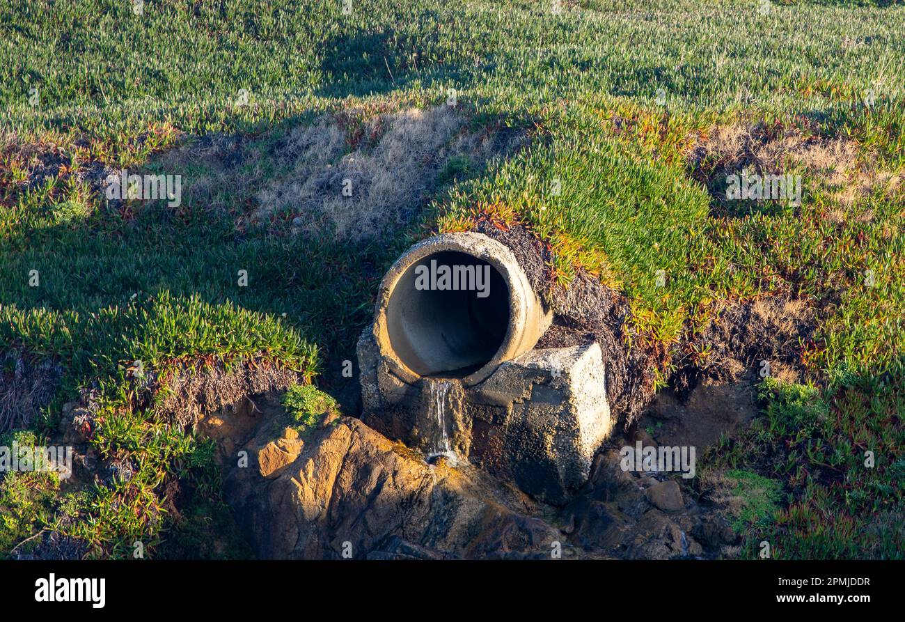 a pipe through which waste water is discharged into nature, polution ...