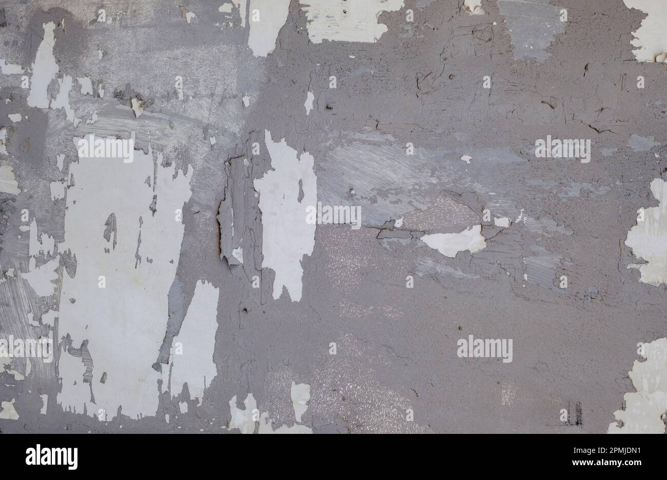 Detail of old wall with scraps of flacking plaster, grunge texture ...
