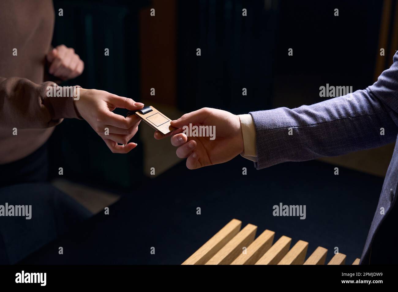 Female administrator gives the guest an electronic key card from the ...