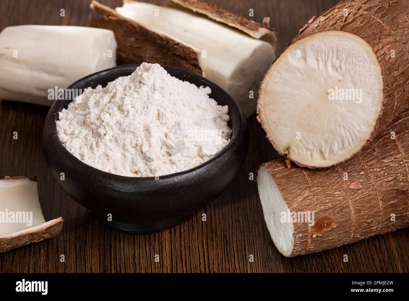 Raw Cassava Root And Starch - Manioc Esculenta; On Wooden Background ...