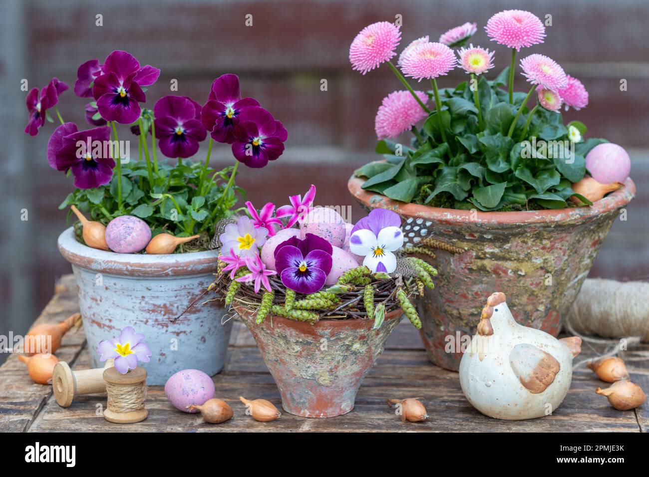 easter arrangement with easter nest and pink spring flowers in vintage ...