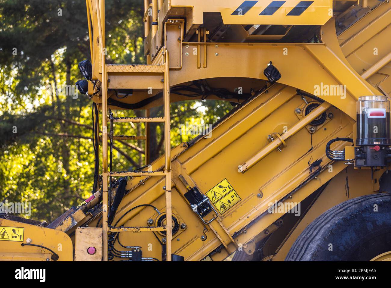Detail of yellow asphalt removing machine Stock Photo - Alamy