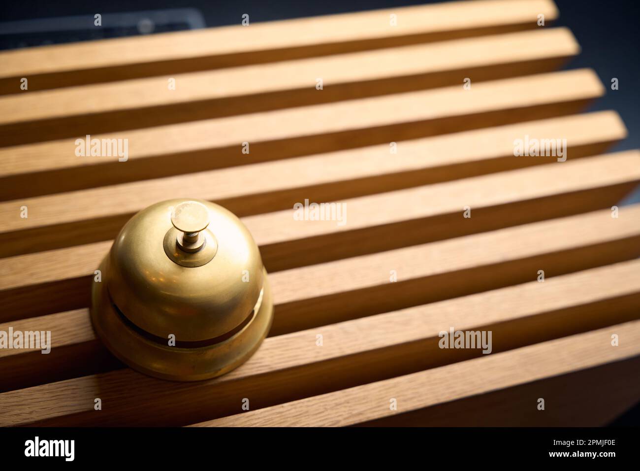 Traditional copper bell for calling staff at the reception desk Stock ...