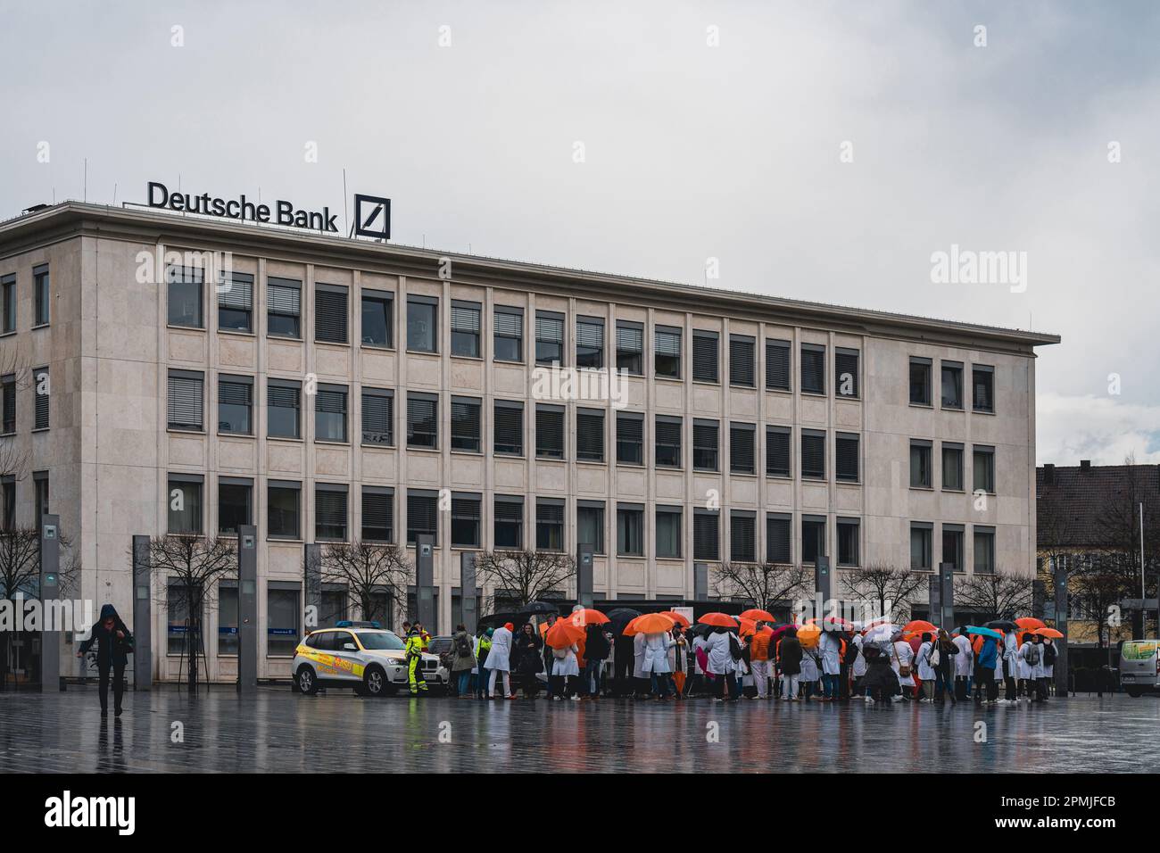 Group of doctors and caregivers waiting downtown at a public square ...