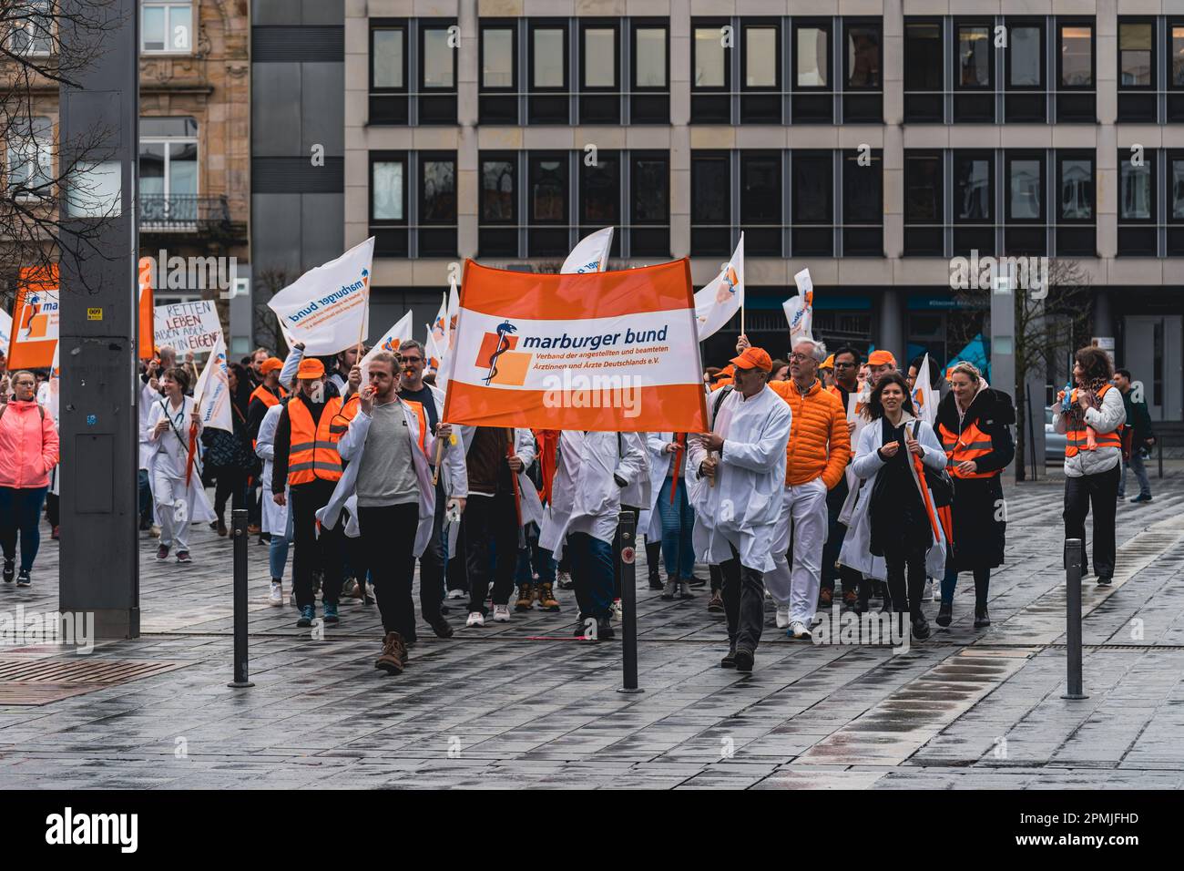 Doctors and caregivers starting protest march with Marburger Bund signs ...