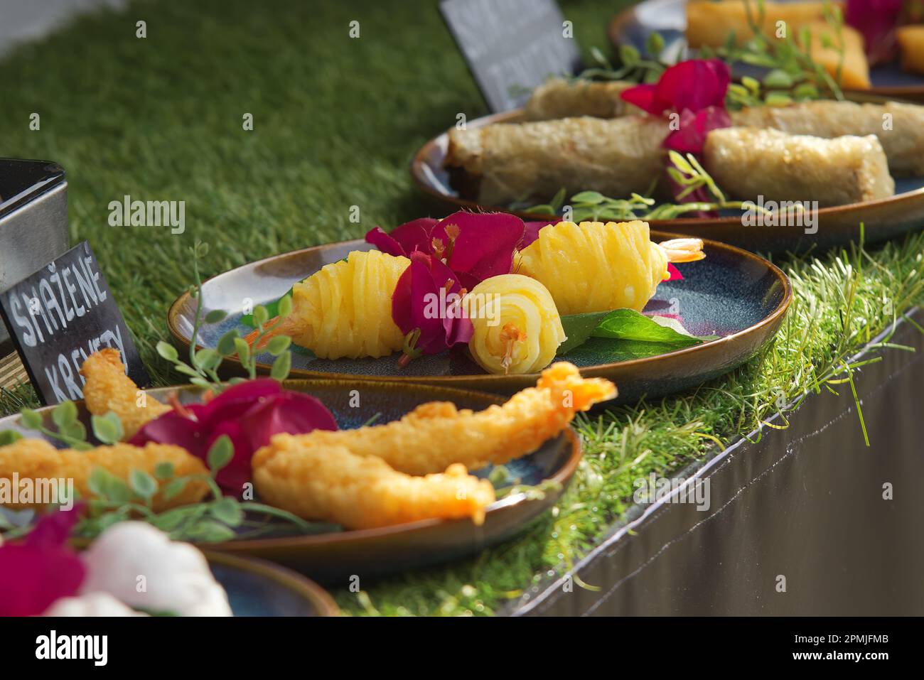 Deep fried shrimps, spring rolls and other fried stuff, closeup of ...