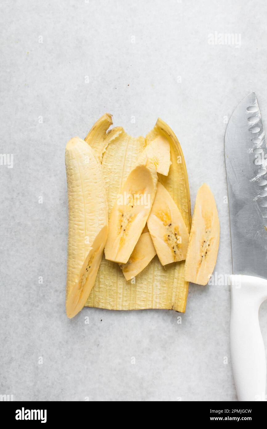 Top view of slices of ripe plantains , slices of yellow plantains for ...