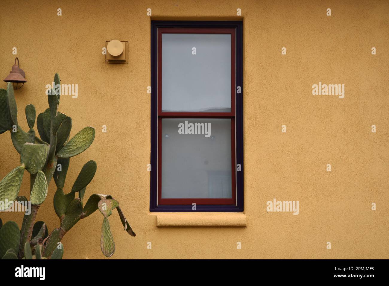 Window in a mustard colored wall, Old Town, Tucson, Arizona Stock Photo ...