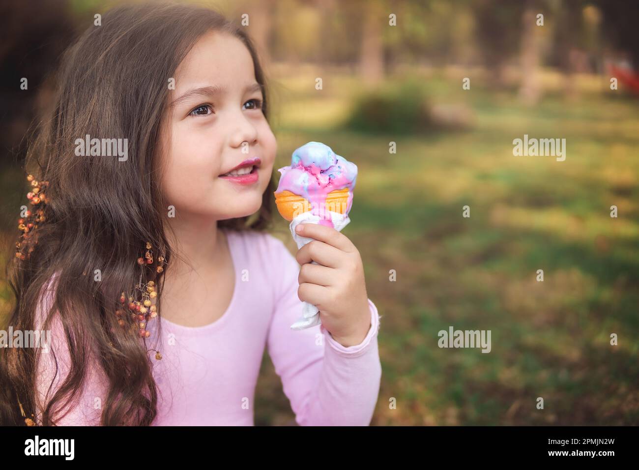 Cute Blonde Curly Haired Girl Eating A Nice Ice Cream In The Forest On 4160