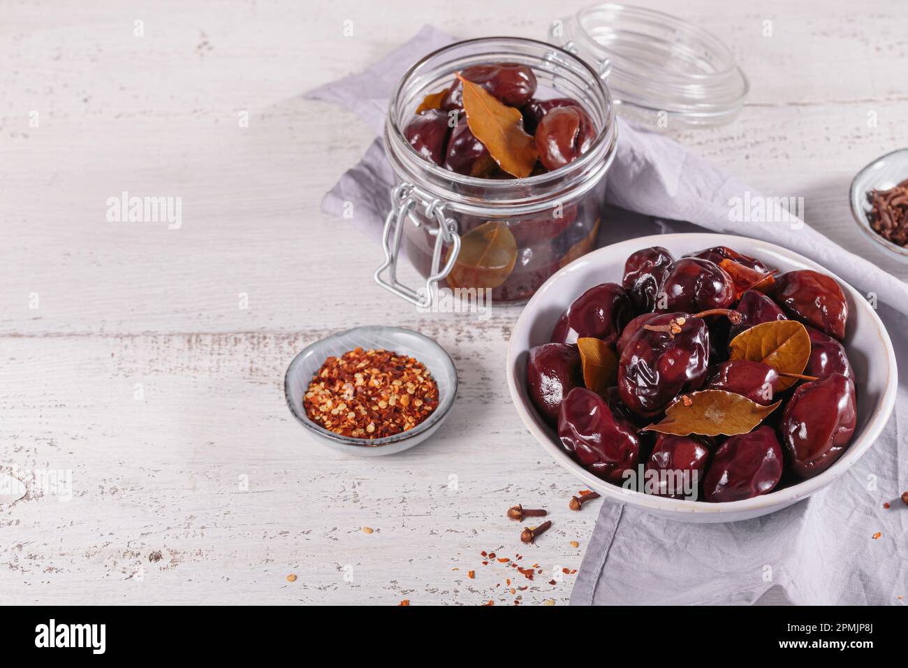 Preserving pickled plums and seasonings Stock Photo - Alamy
