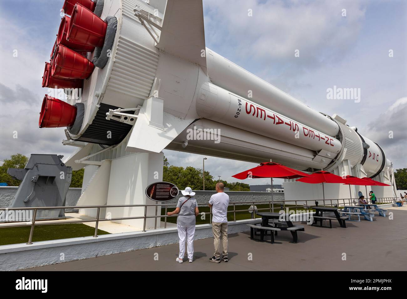 Tourists look on at awe at the size of the engine used to propel ...