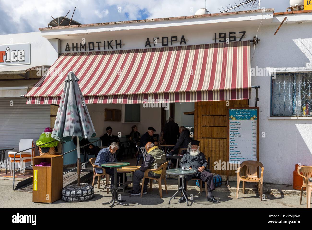 Cafe scene with orthodox pop in Polis Chrysochous, Cyprus Stock Photo ...