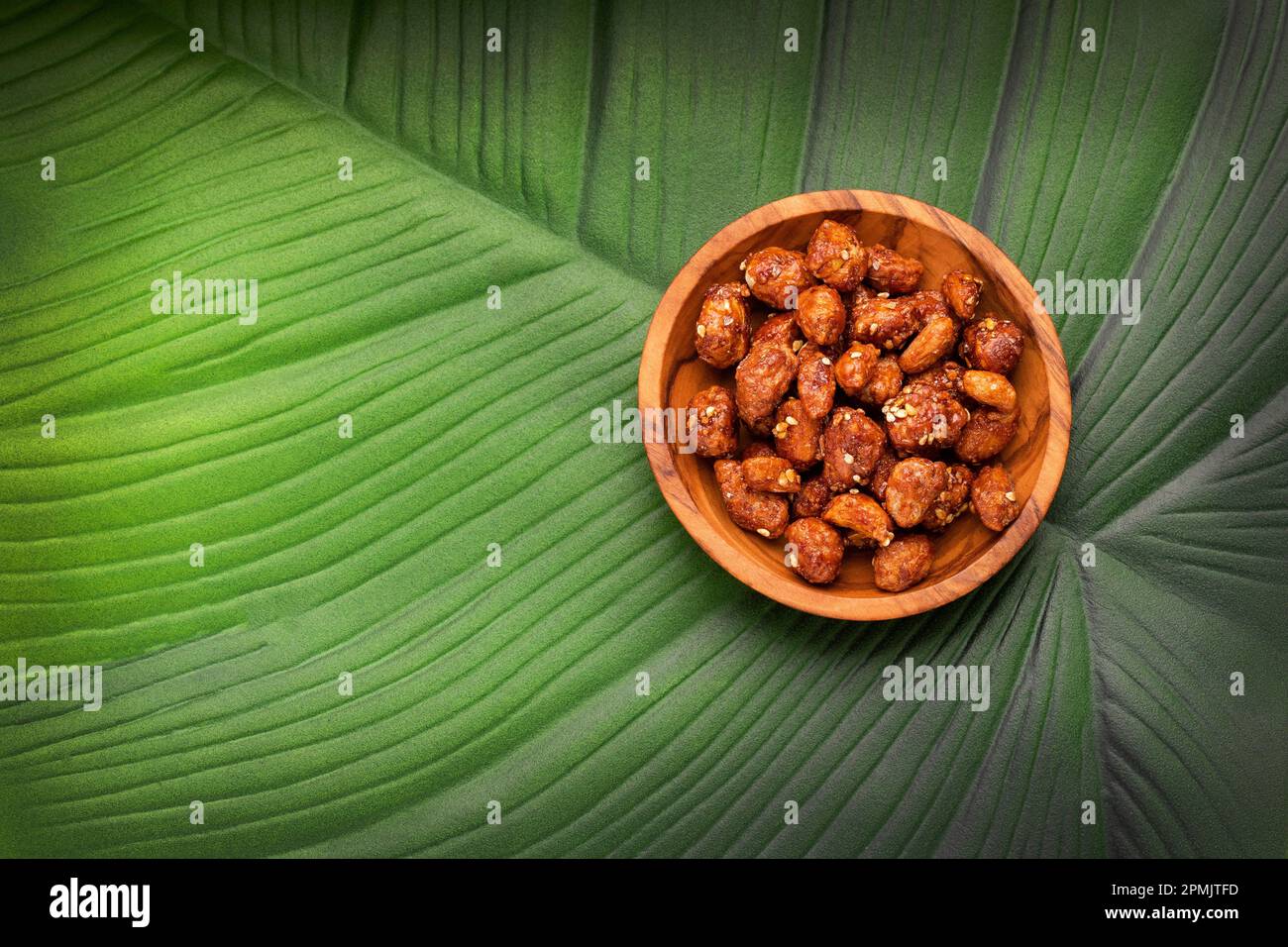 roasted praline peanuts with white sesame seeds - Arachis hypogaea ...