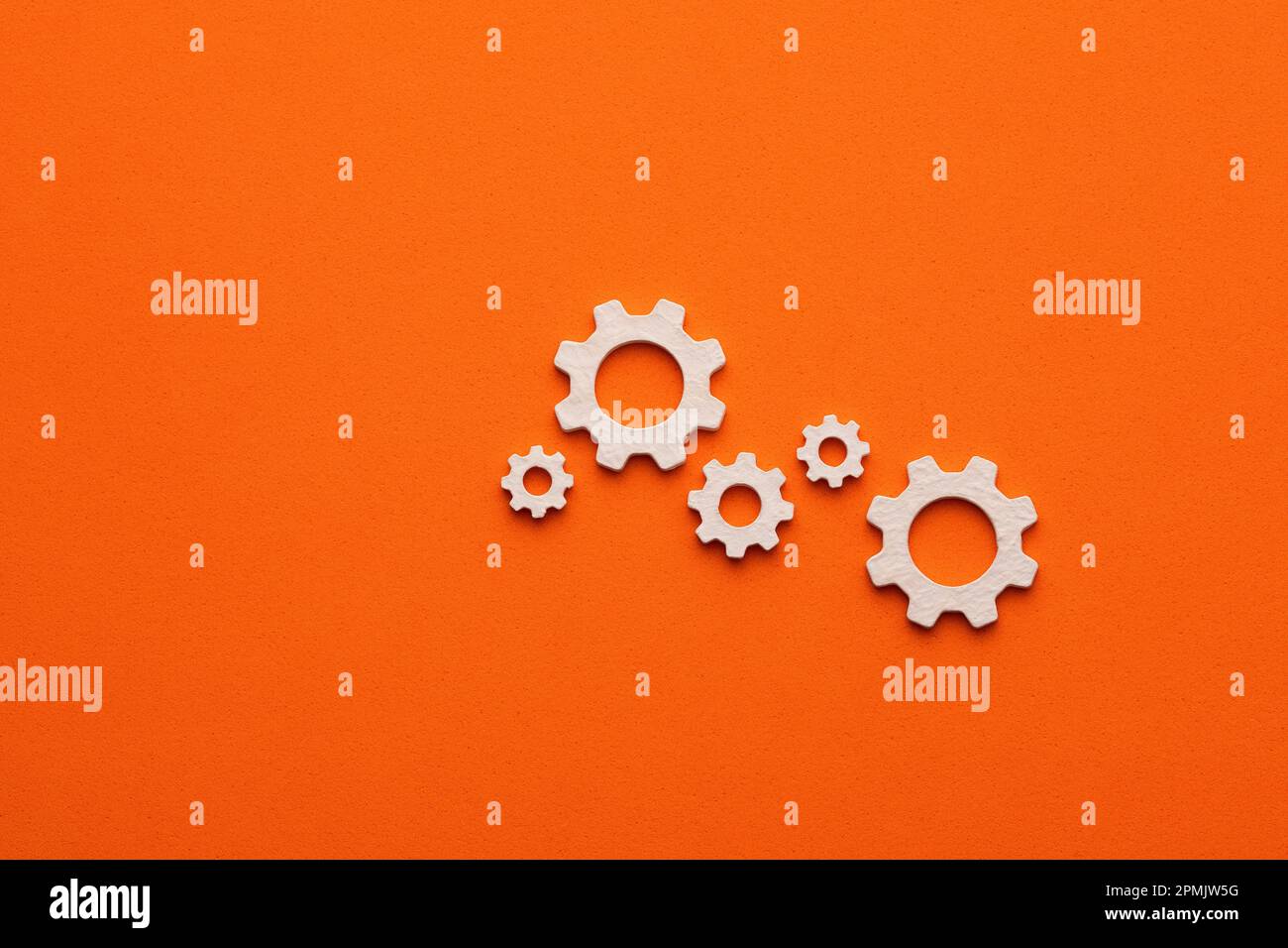 Gears on orange color background - Business mechanism concept, flat ...