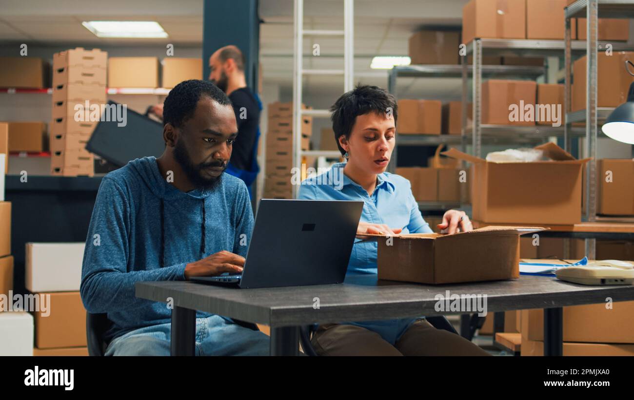 Man and woman preparing shipment order with merchandise from warehouse ...